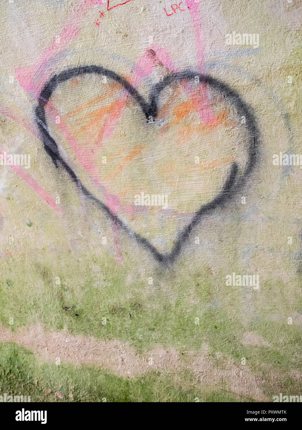 Heart-shaped graffiti on under road public walkway Stock Photo - Alamy