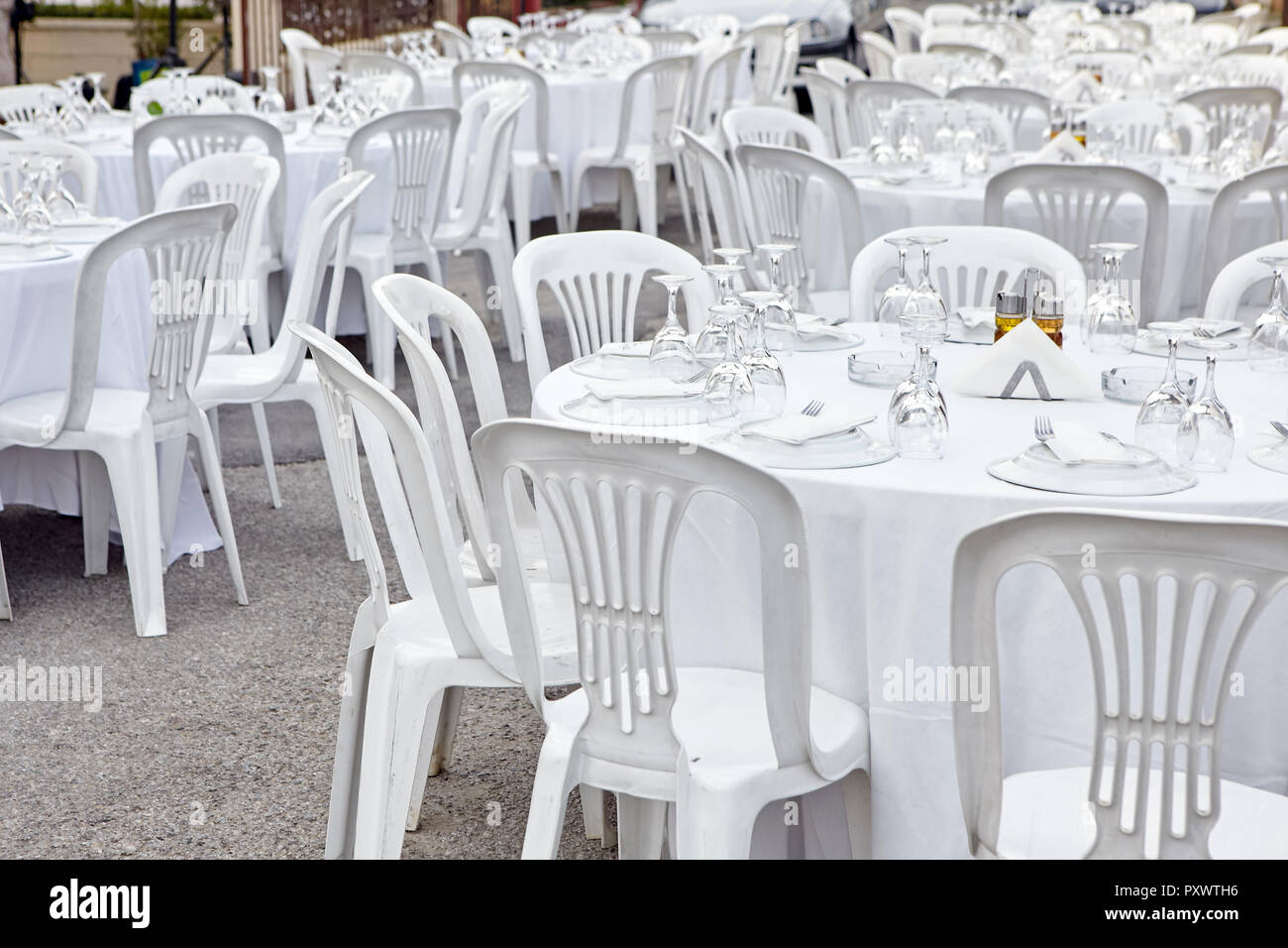 Plastic tables setting for an outdoor reception Stock Photo - Alamy