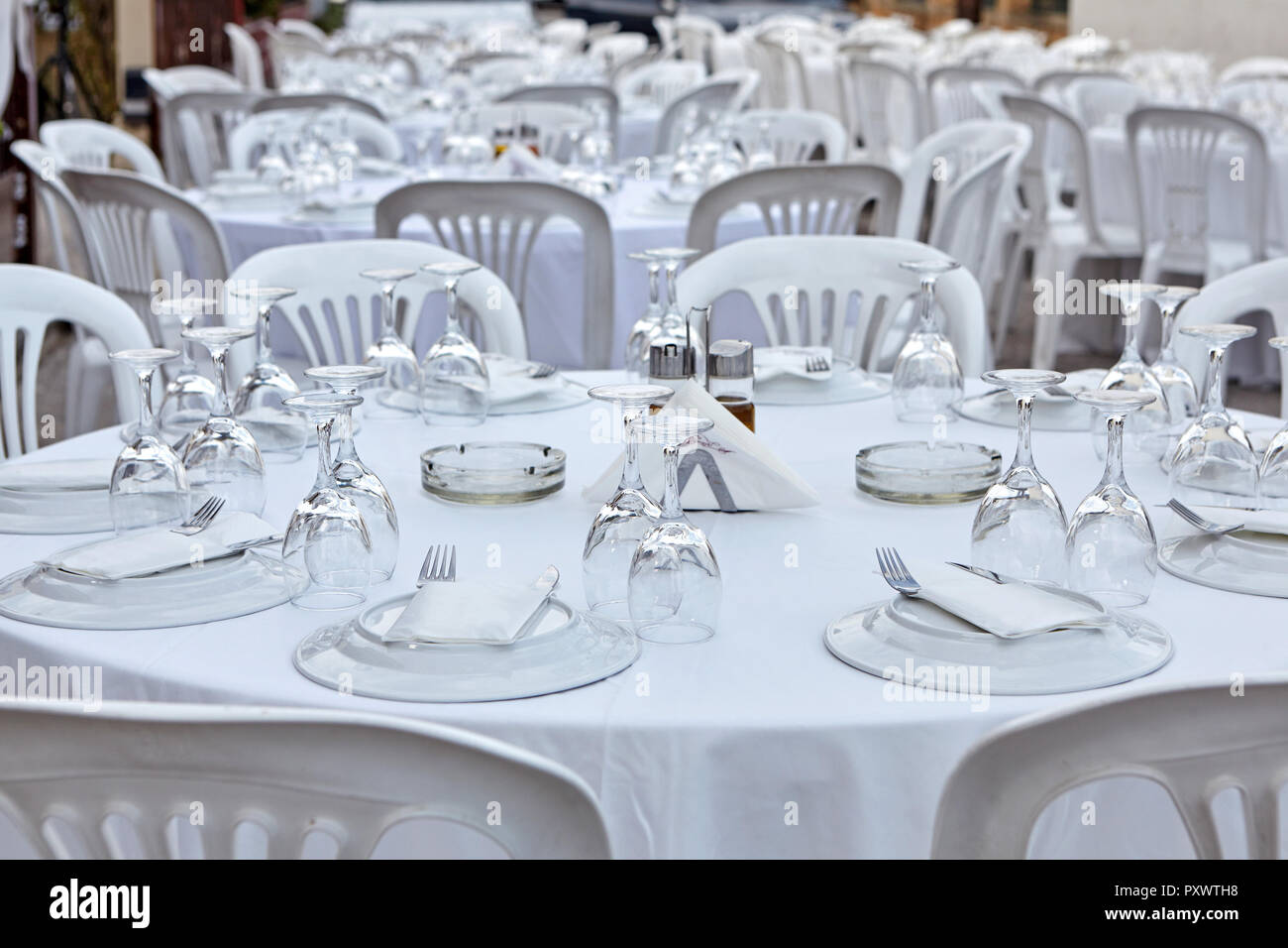 Plastic tables setting for an outdoor reception Stock Photo - Alamy