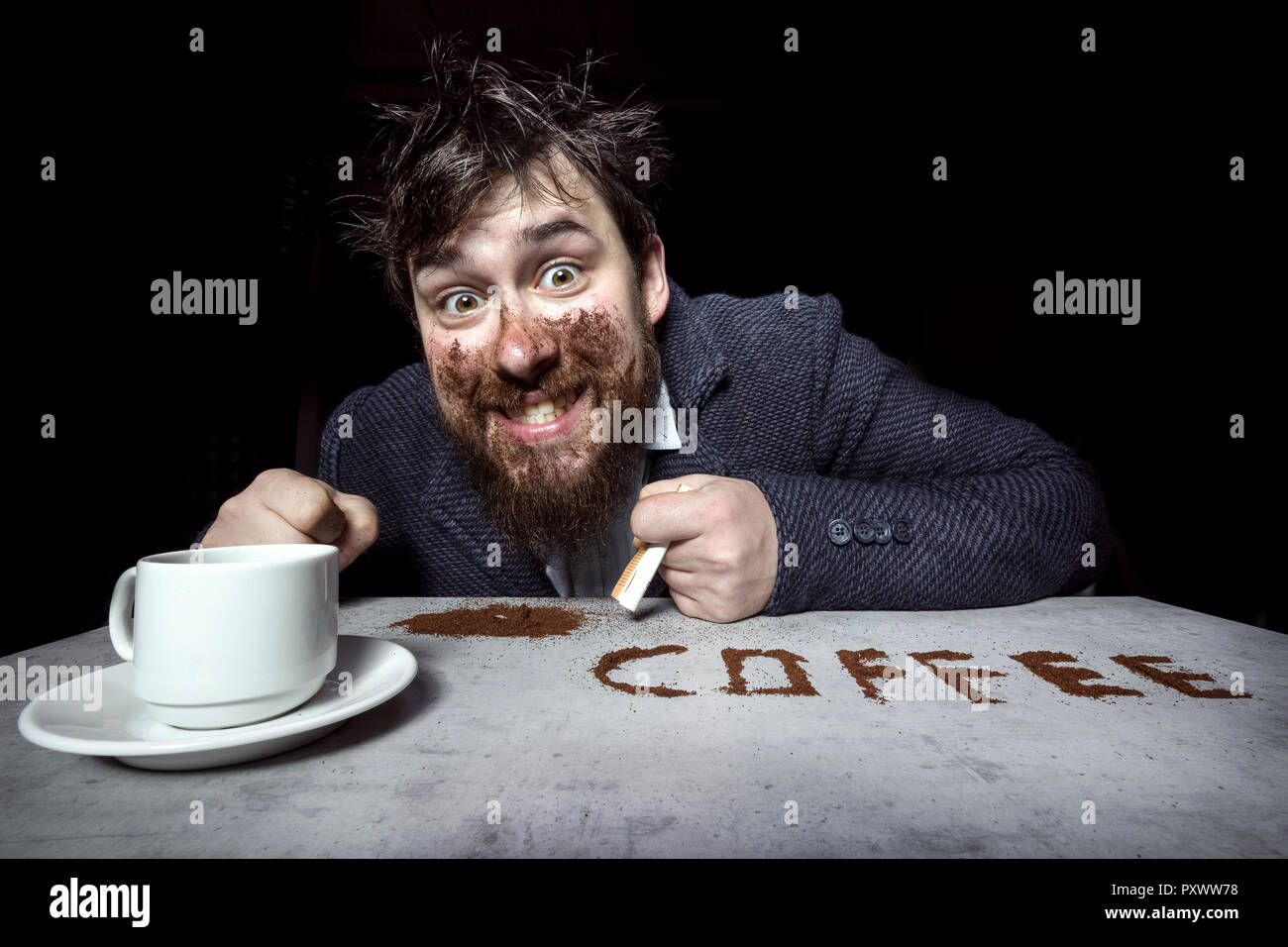 bearded man smeared with coffee, looking madly at the camera, the ...