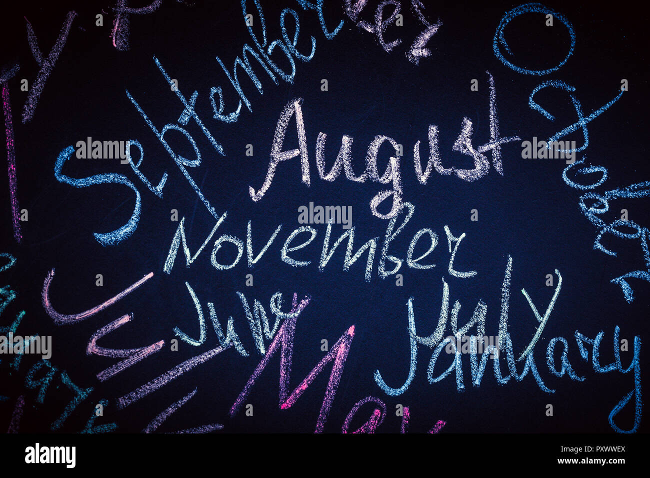 months written in colorful chalk, background image Stock Photo - Alamy