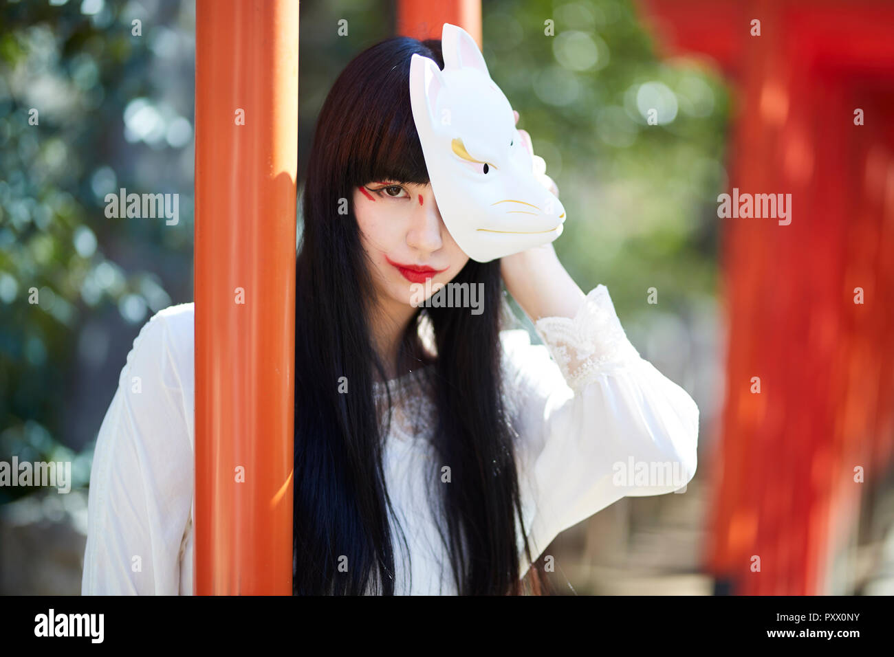 Young Japanese woman with fox mask Stock Photo - Alamy