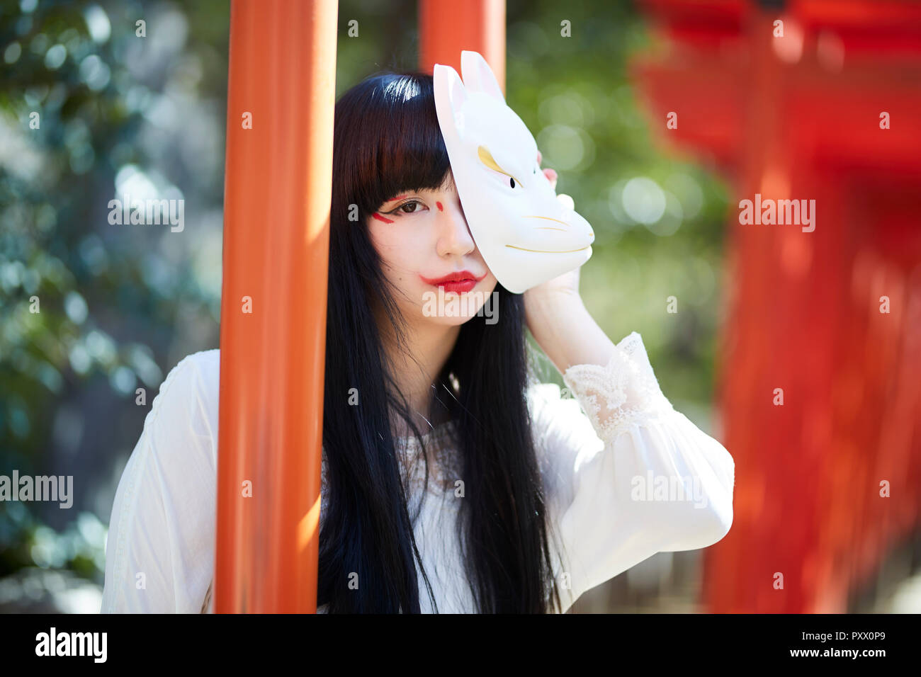 Young Japanese woman with fox mask Stock Photo - Alamy