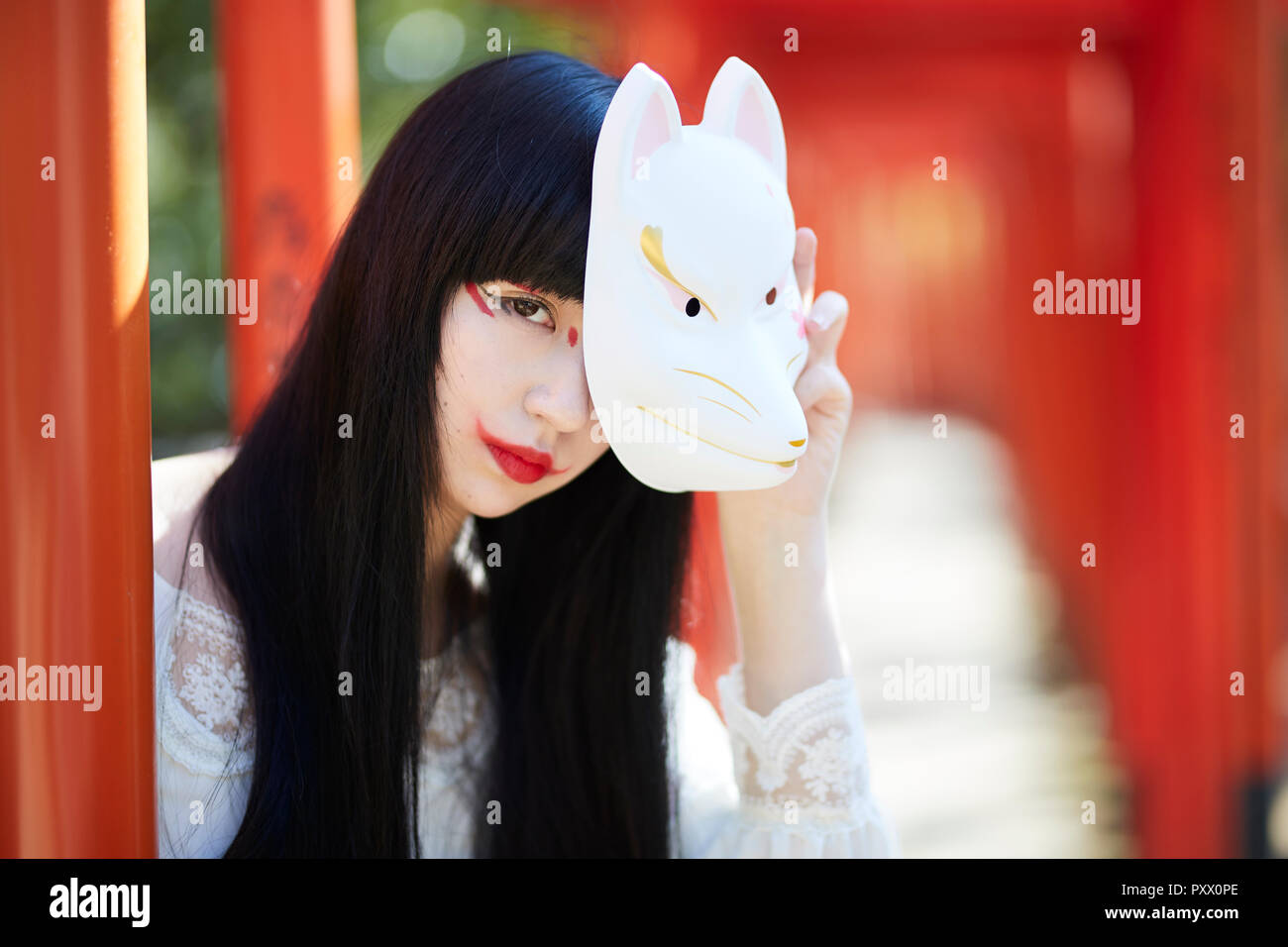 Young Japanese woman with fox mask Stock Photo - Alamy
