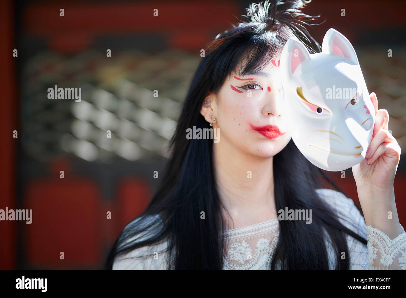 Young Japanese woman with fox mask Stock Photo - Alamy