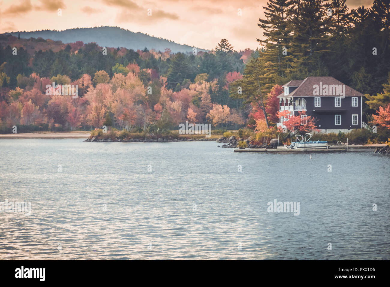 Long Lake, Adirondacks, NY, in the fall surrounded by brilliant ...