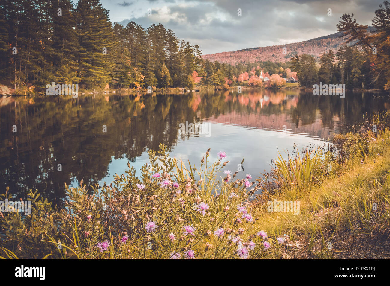 Long Lake, Adirondacks, NY, in the fall surrounded by brilliant ...