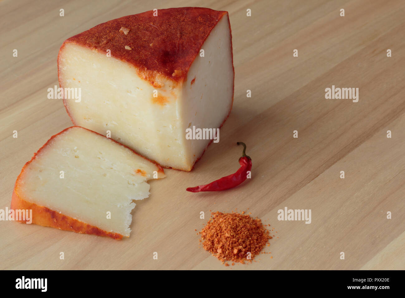 Pecorino Crotonese sheep milk cheese with whole and ground chili pepper ...