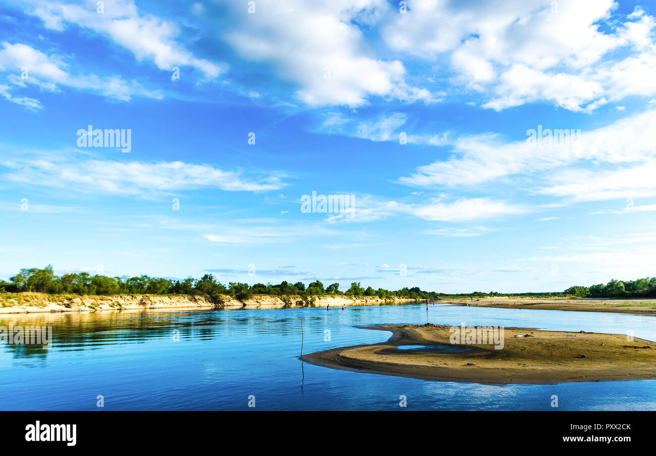 Dried shallow river with small sandy islands due to drought and no rain ...