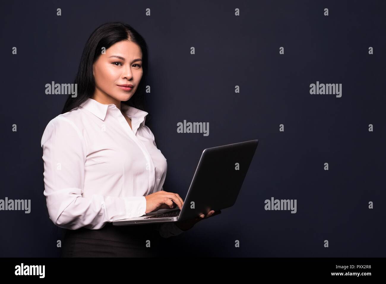 Brunette woman hug laptop Stock Photo - Alamy