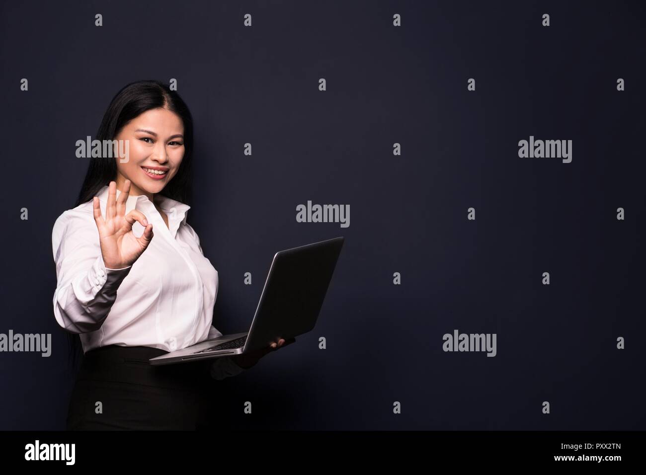 Brunette woman hug laptop Stock Photo - Alamy