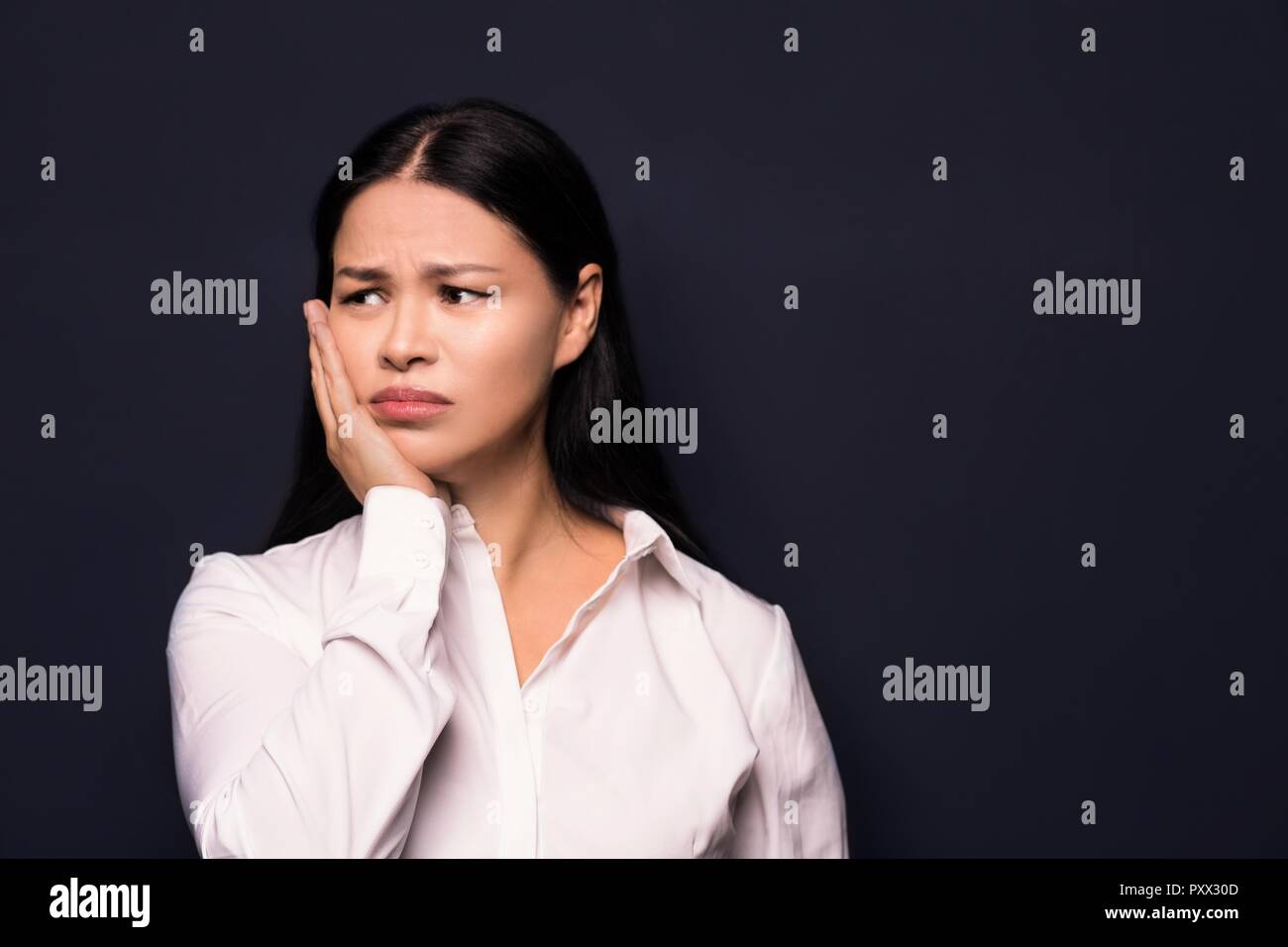 Portrait of tired young business woman Stock Photo - Alamy