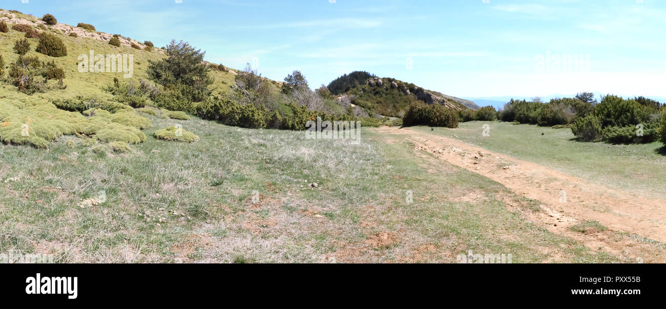A landscape of a path on the edge of Peña Oroel mount, with the ...