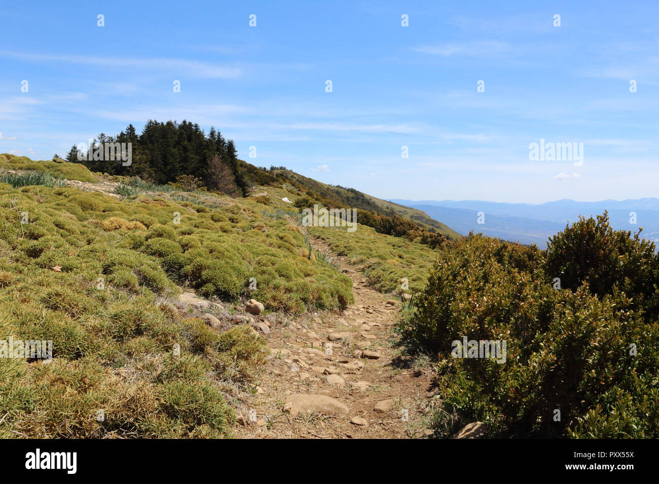 A landscape of a path on the edge of Peña Oroel mount, with the ...