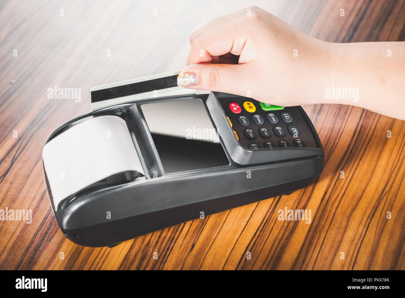 Hand Swiping Credit Card In Store good Stock Photo - Alamy