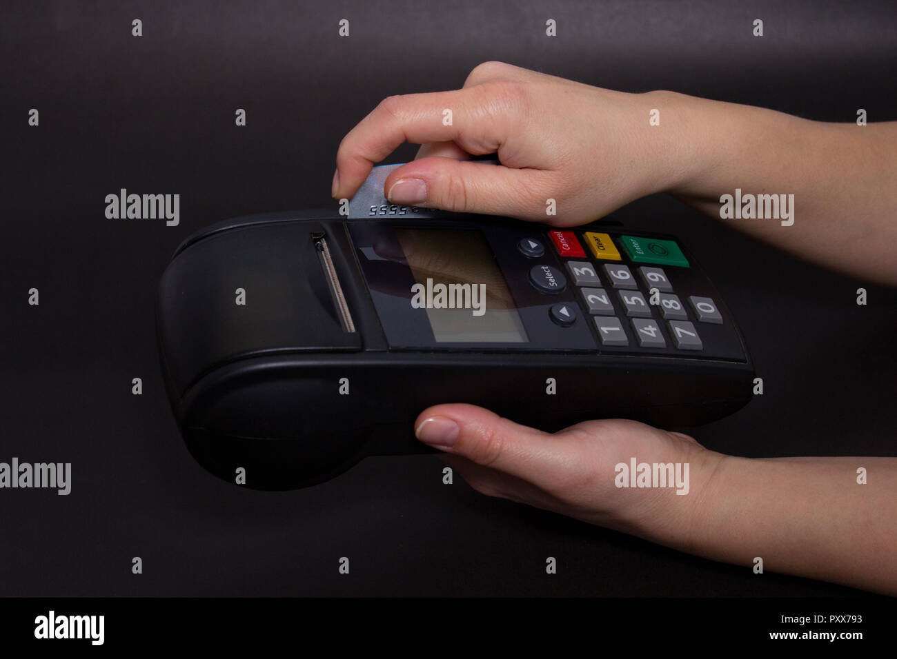 Hand Swiping Credit Card In Store. Female hands with credit card and ...