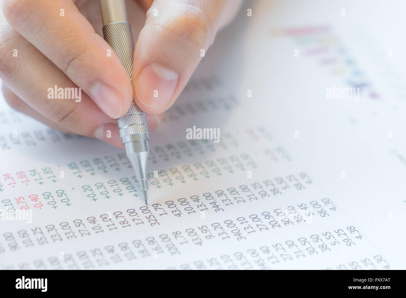 Hand write on Various financial charts on the table Stock Photo - Alamy