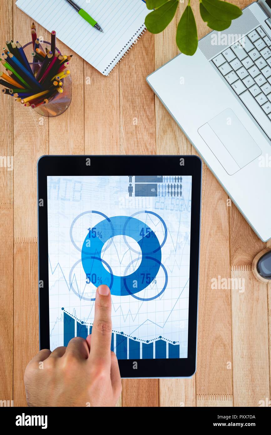 composite of hands using tablet computer with desk background Stock ...