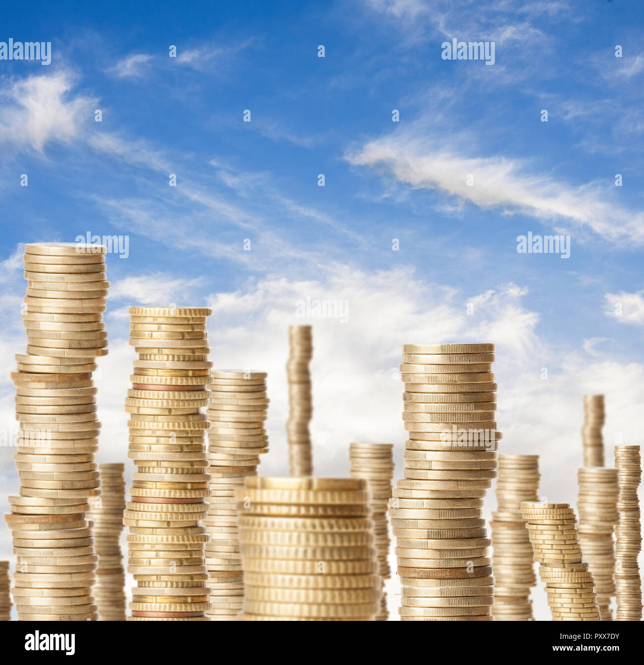 high coin towers representing the richness under a blue sky Stock Photo ...