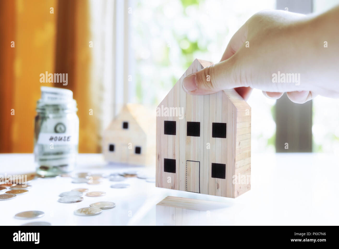 Money house from coins hi-res stock photography and images - Alamy