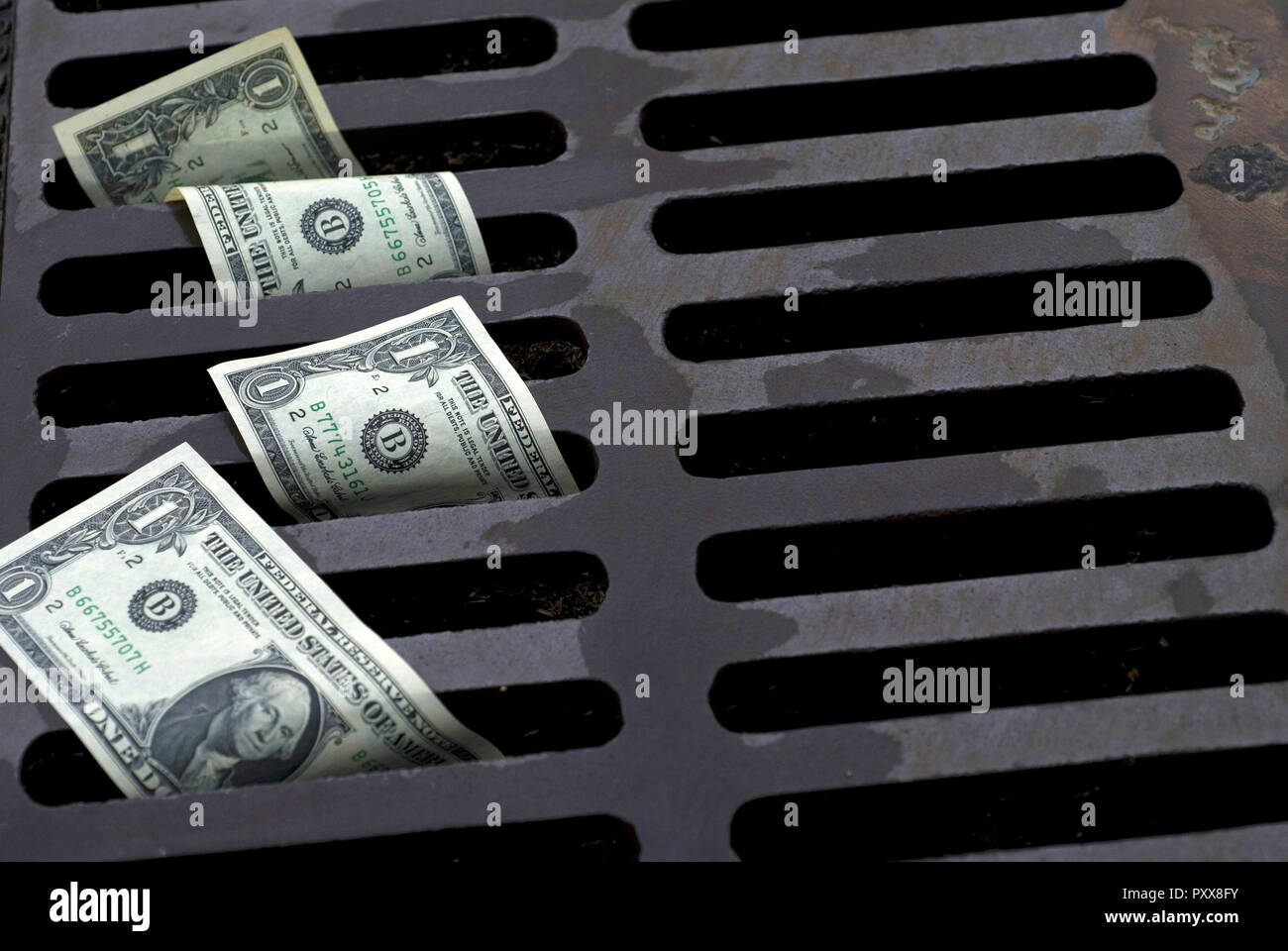 Throw money down the drain hi-res stock photography and images - Alamy