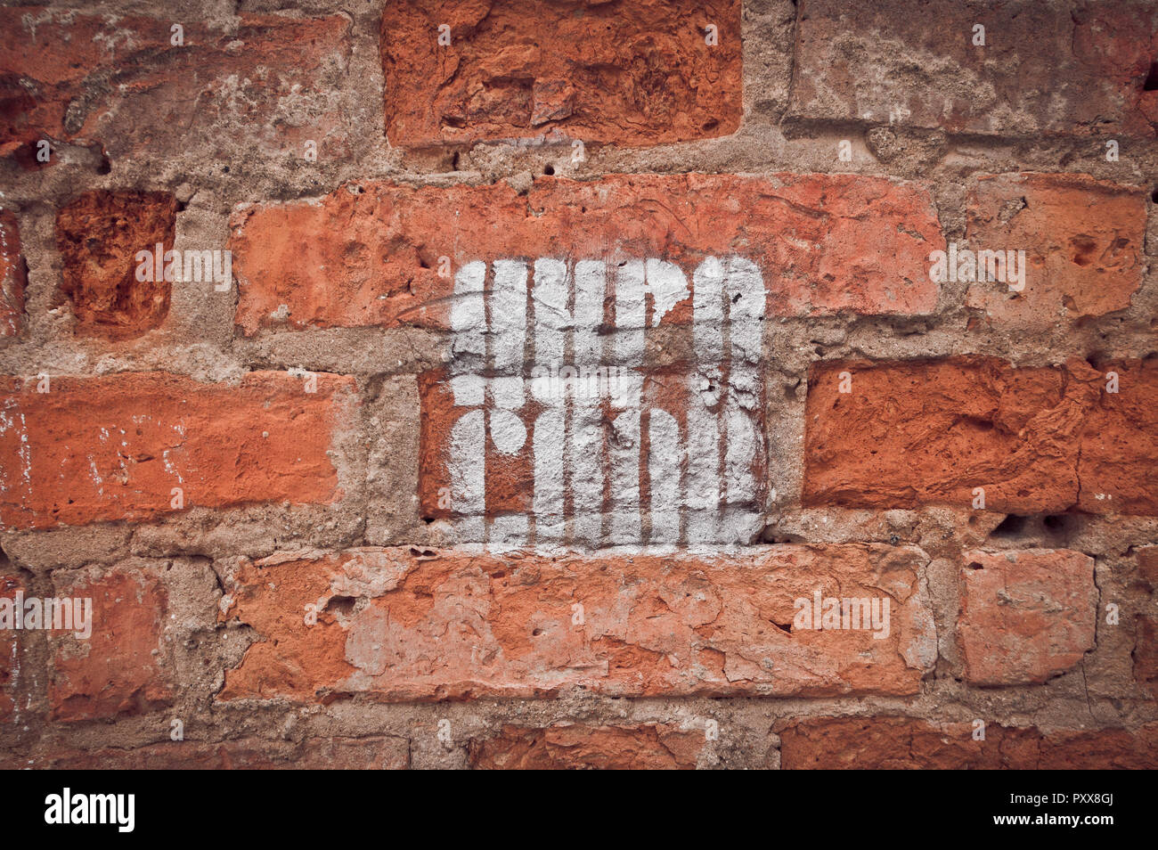 Image of a old red brick wall with a worn inscription Stock Photo - Alamy