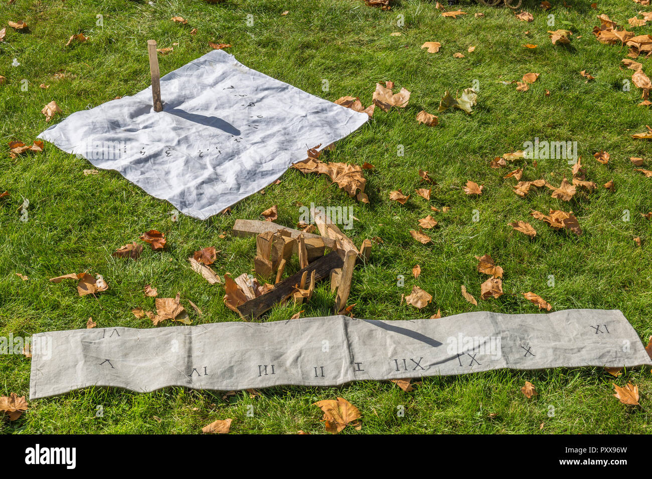 Sun dial and calendar using paper and a wooden peg Stock Photo - Alamy