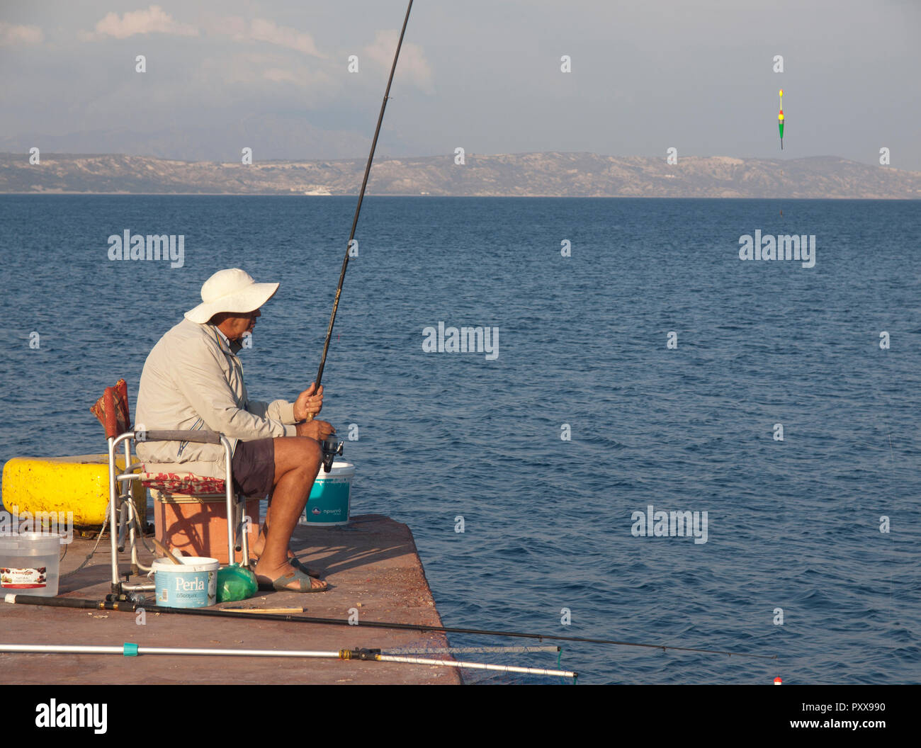 Fishing at the harbour in Kefalos, Kos Stock Photo - Alamy