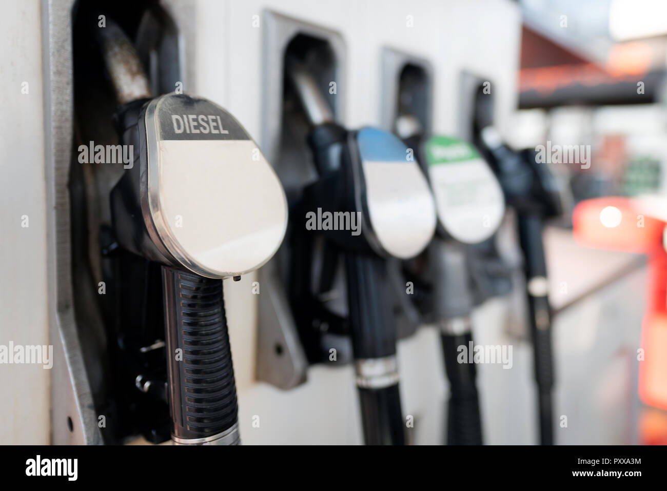 Petrol pump filling nozzles. Fuel at gas station close up Stock Photo ...