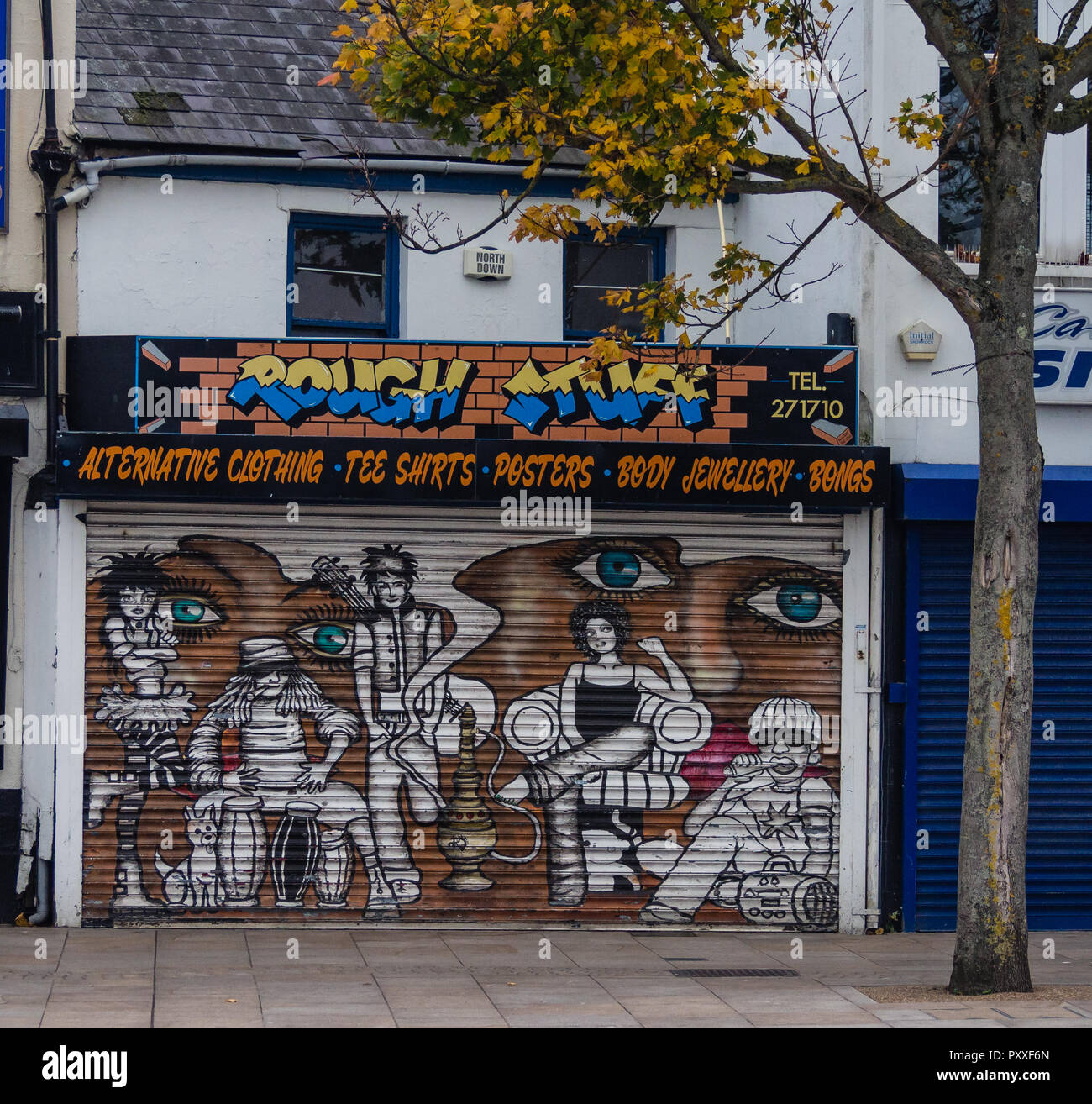 "Rough Stuff" graffiti painted steel shutters on a shopfront in Bangor ...