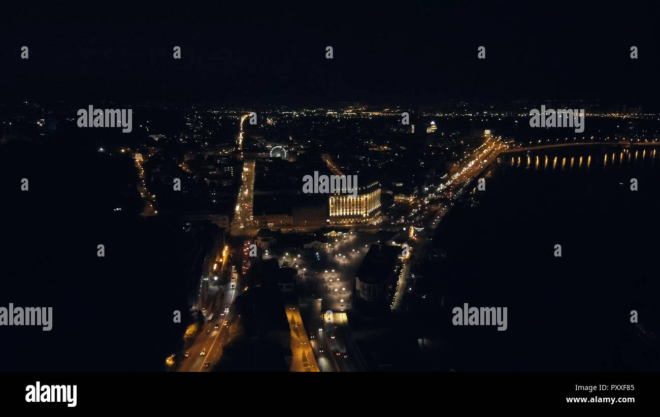 Aerial view from Drone: Top view of the night promenade with bridges ...