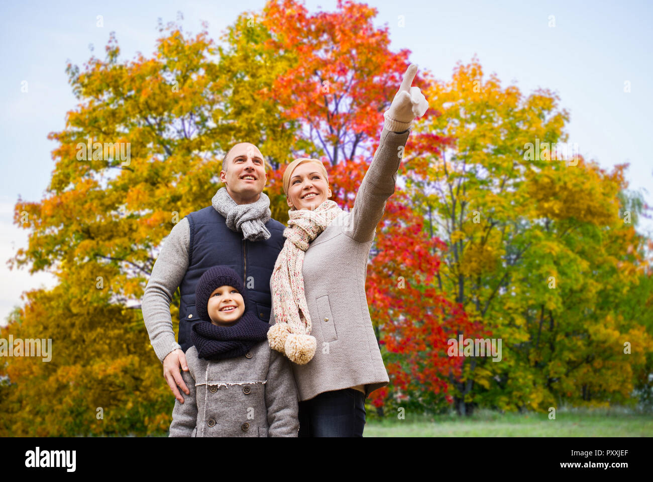 happy family over autumn park background Stock Photo - Alamy
