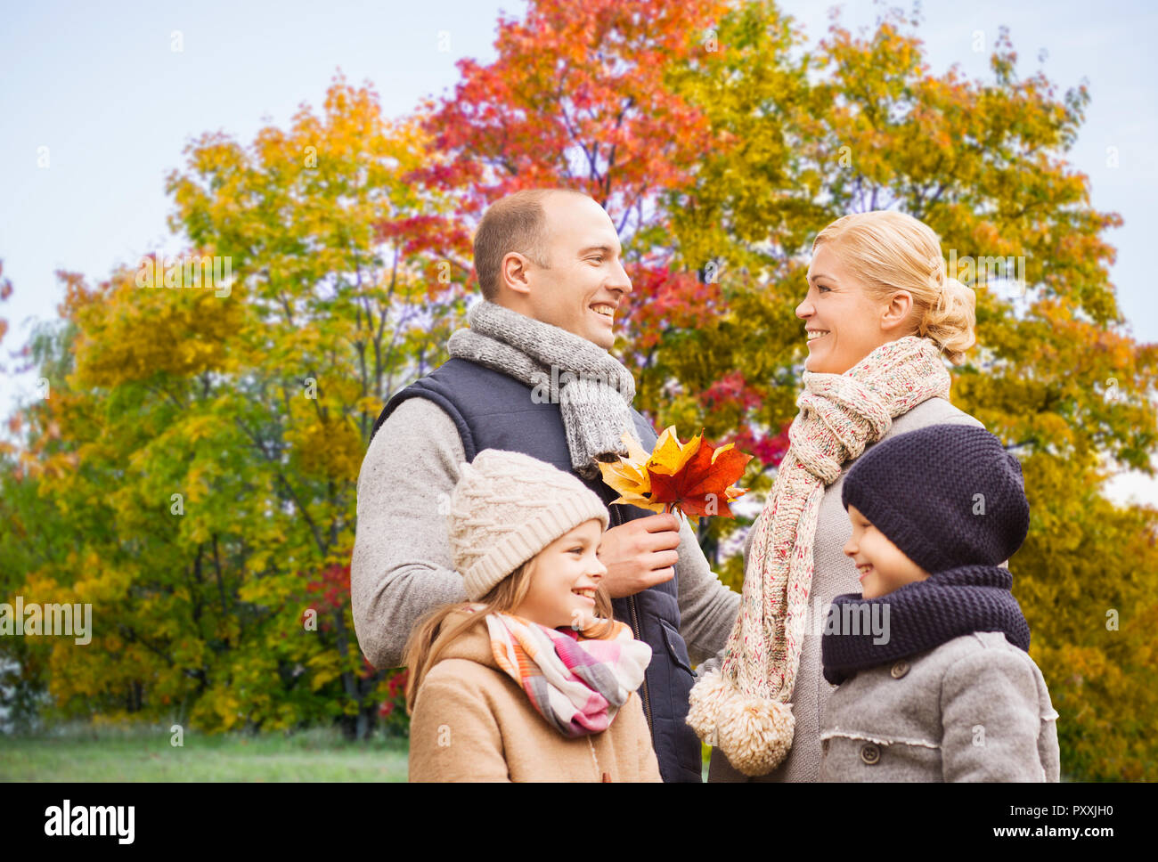 happy family over autumn park background Stock Photo - Alamy