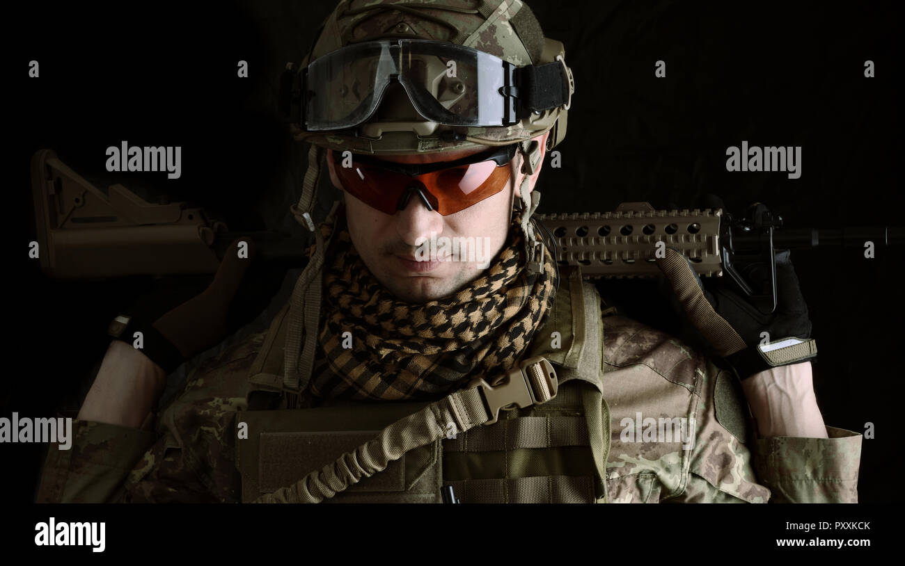 close up portrait of handsome military man. Macro shot on black ...