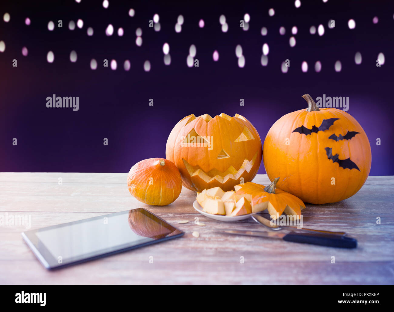 halloween jack-o-lantern, pumpkins and tablet pc Stock Photo - Alamy