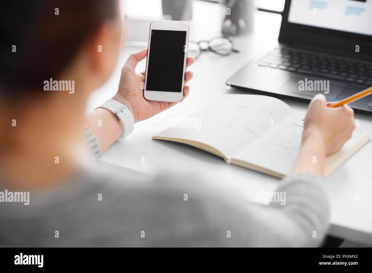web designer working on smartphone user interface Stock Photo - Alamy