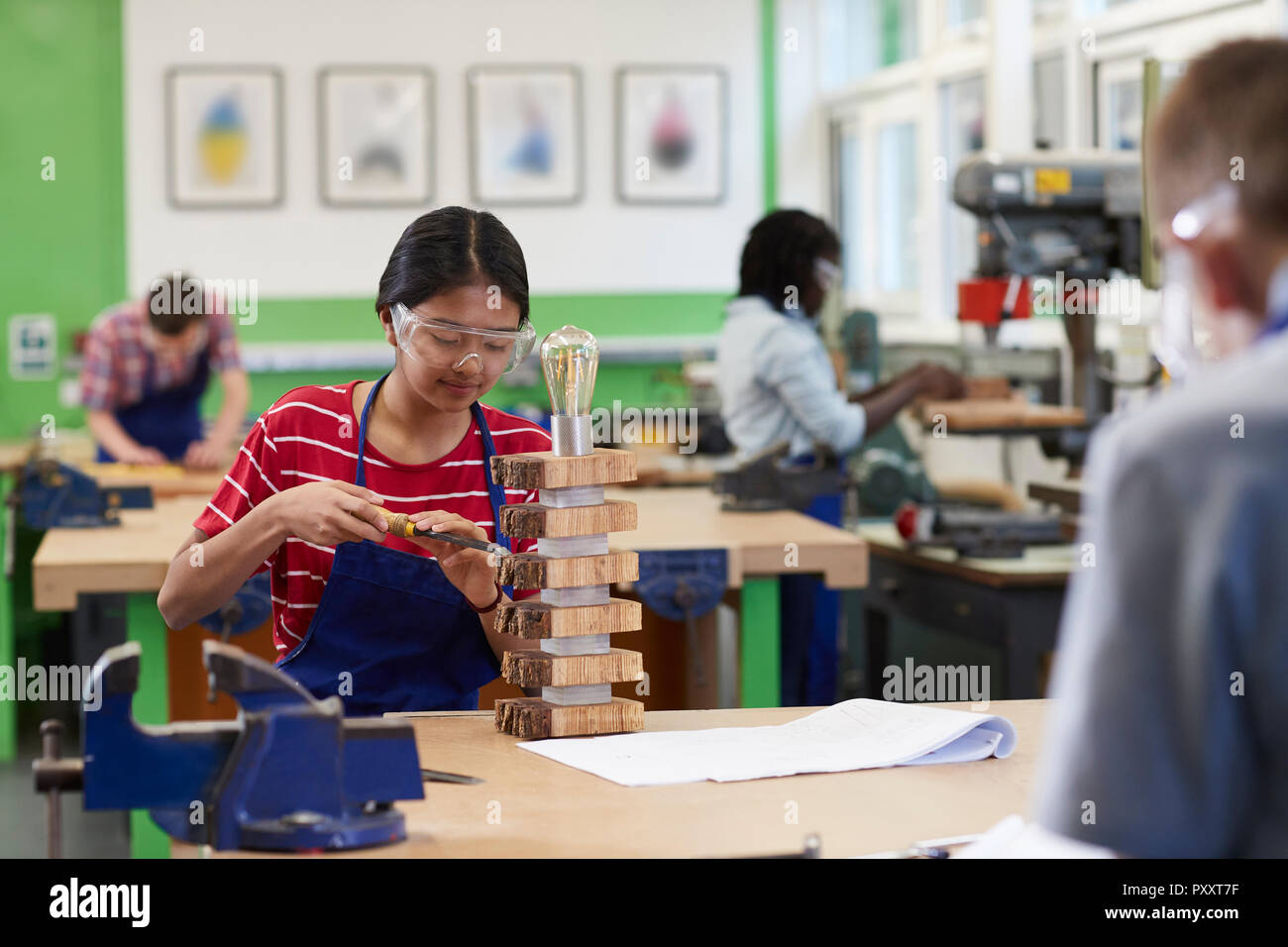 Female High School Student Building Lamp In Woodwork Lesson Stock Photo ...