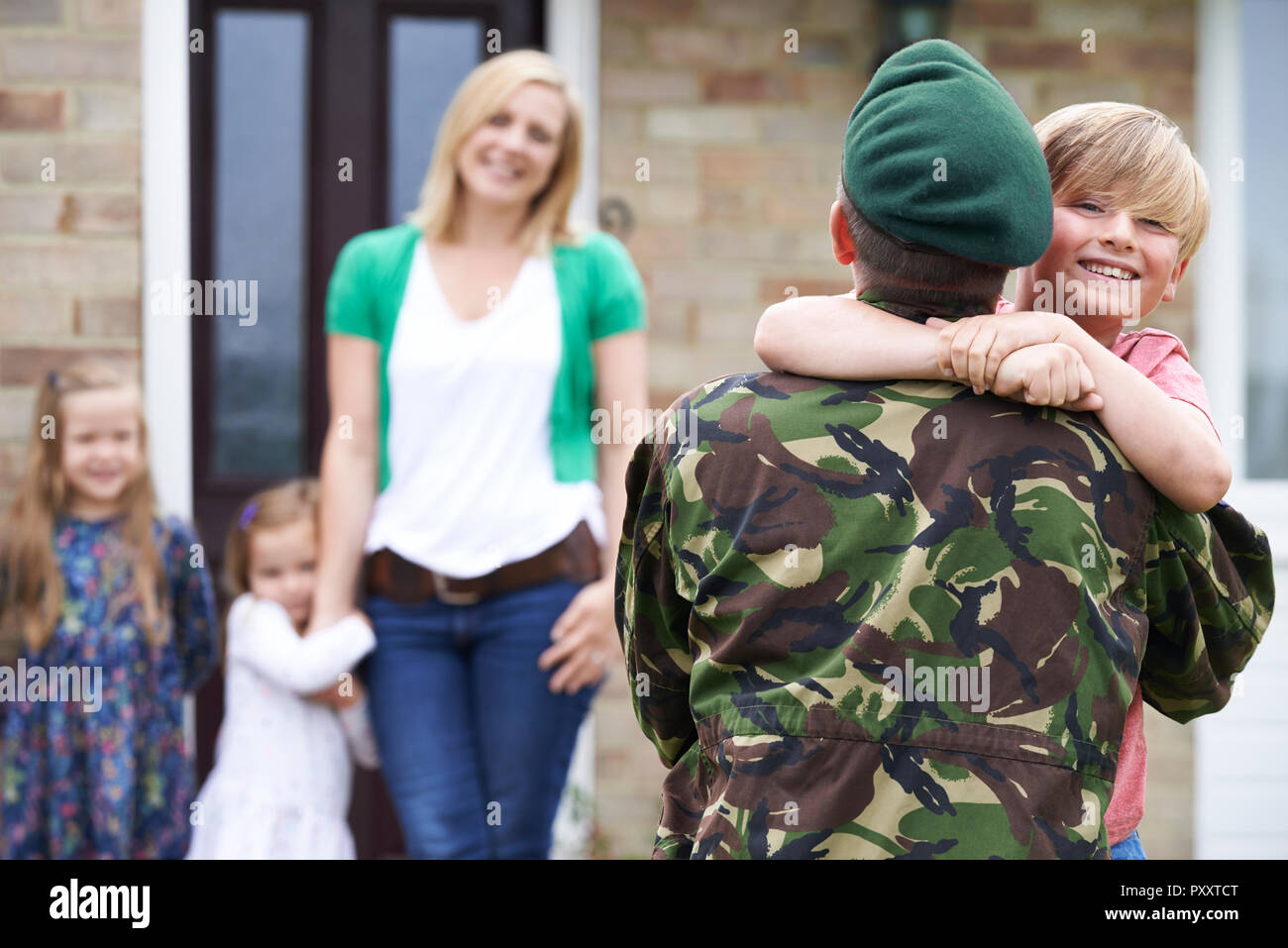 Son Greeting Military Father On Leave At Home Stock Photo - Alamy