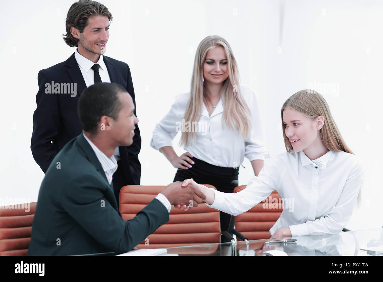 handshake Manager and the client in the office Stock Photo - Alamy