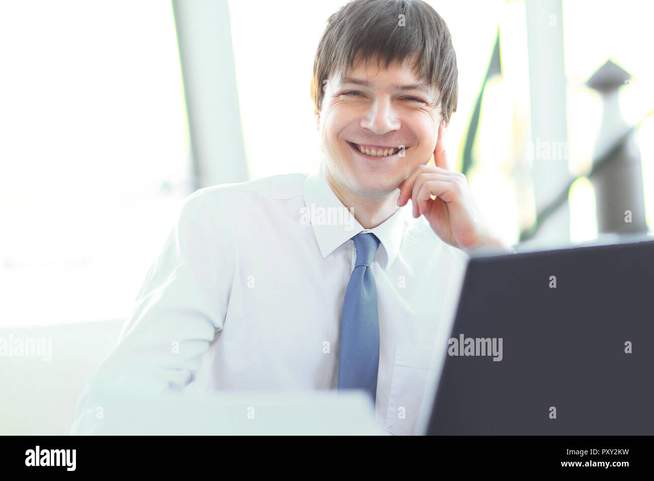 employee of the company working on the laptop Stock Photo - Alamy