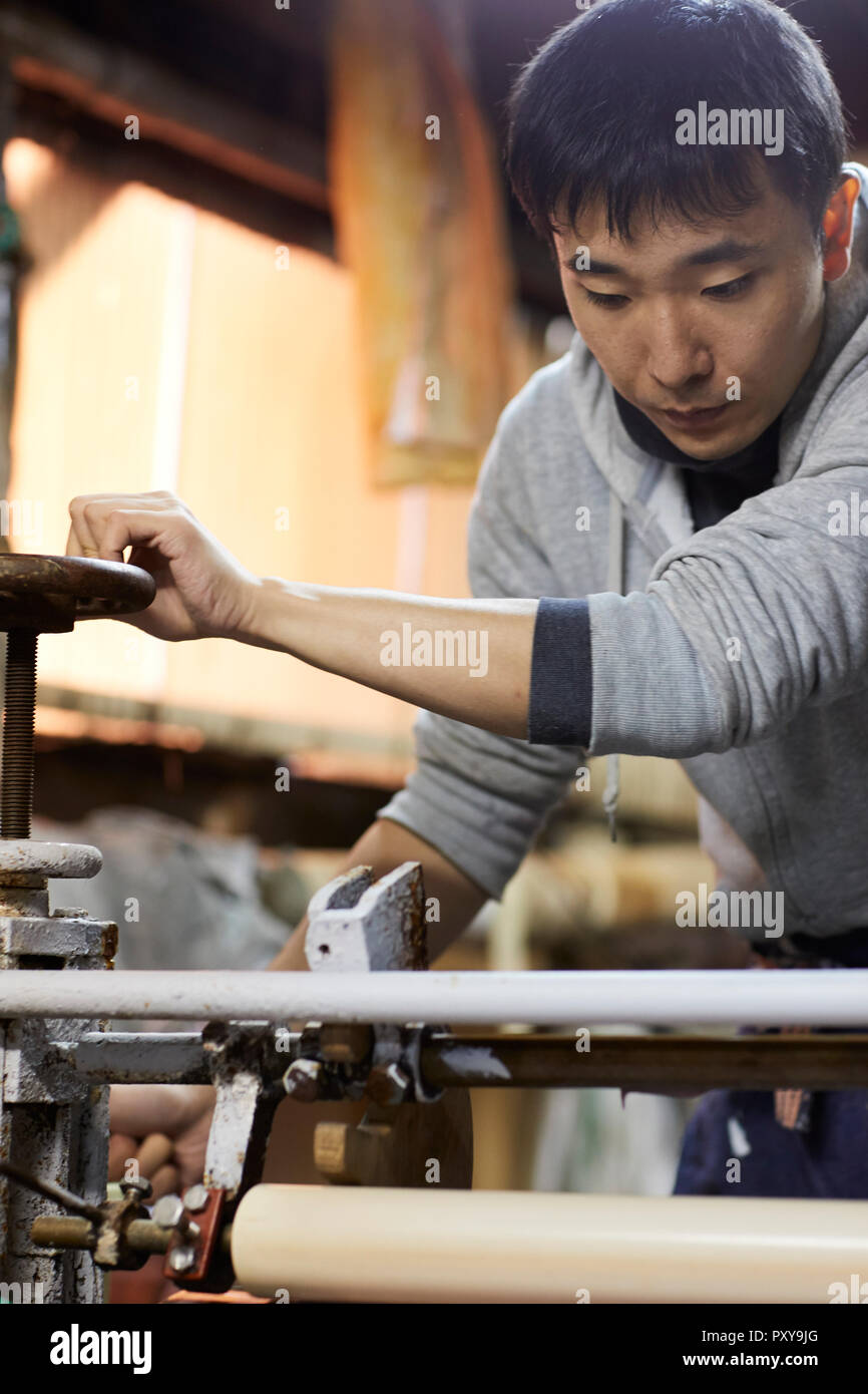 Japanese artisan working in the studio Stock Photo - Alamy