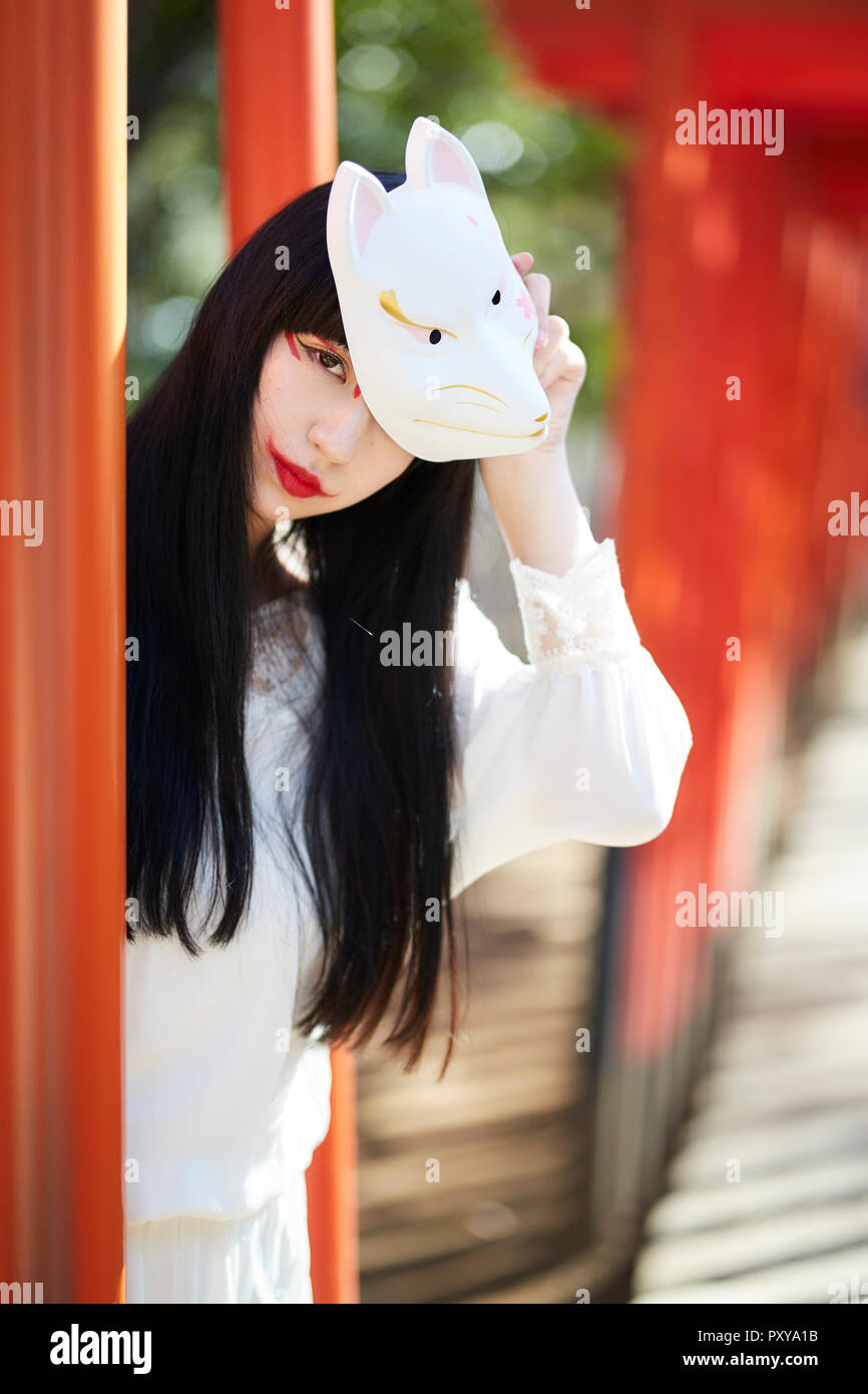 Young Japanese woman with fox mask Stock Photo - Alamy