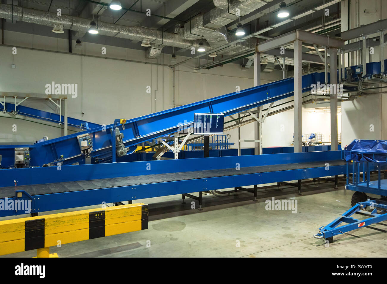 Baggage claim area with empty baggage carousels Stock Photo - Alamy