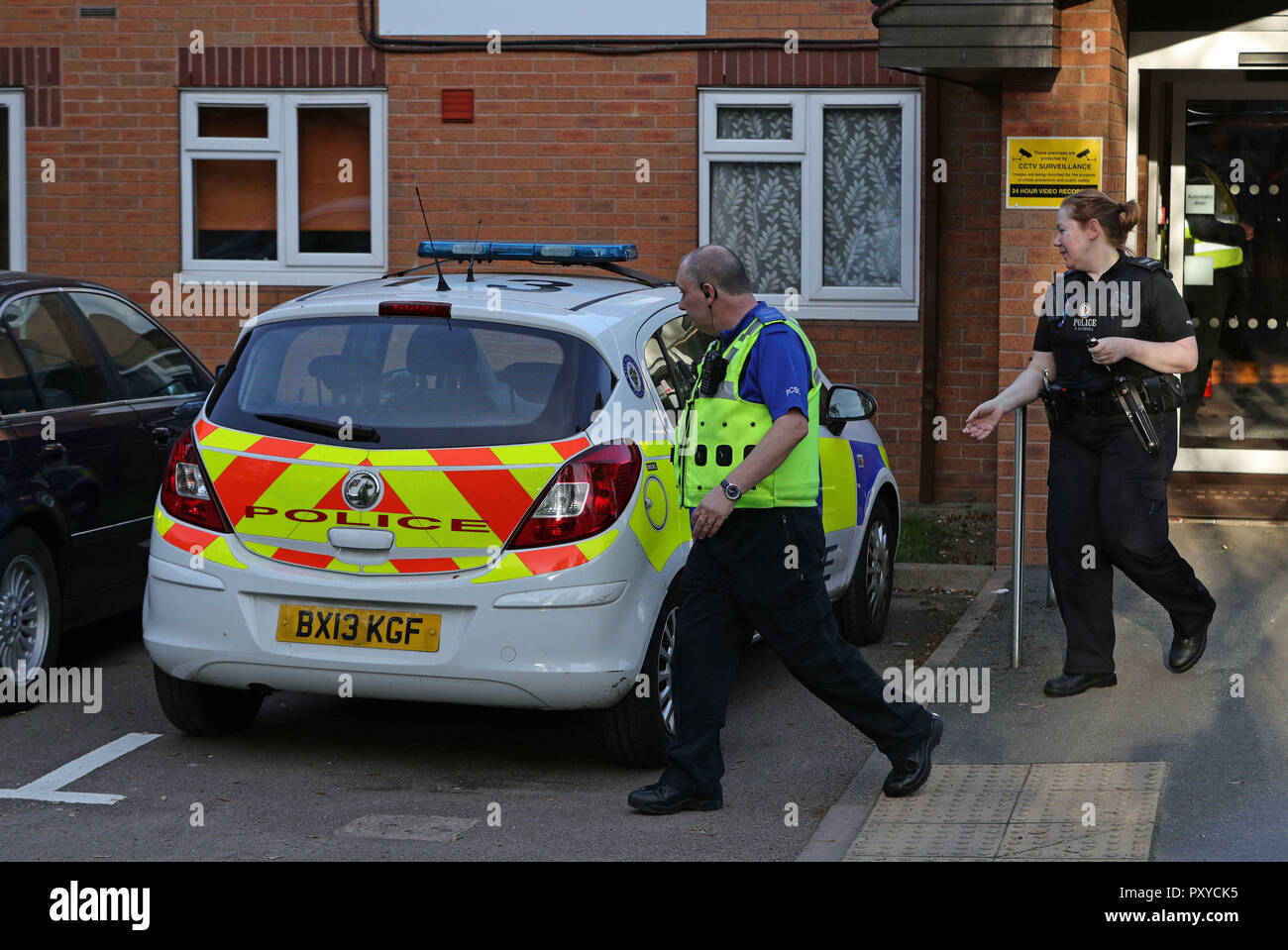 Officers from West Midlands Police leave a sheltered retirement housing ...