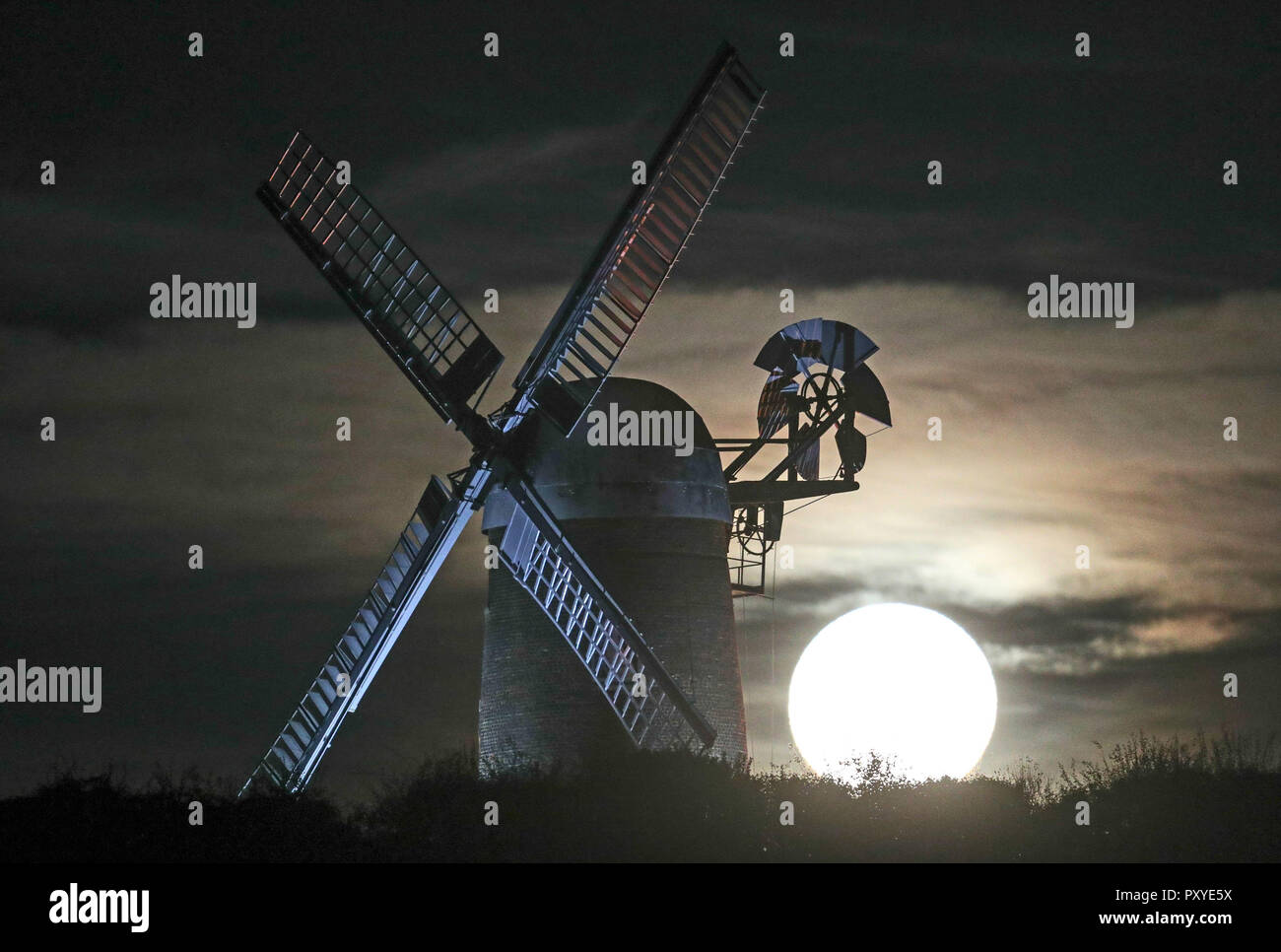 Near full hunters moon rises behind wilton windmill in wiltshire hi-res ...
