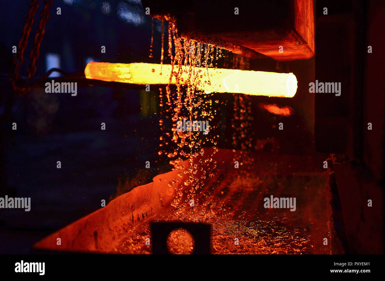 The process of forging metal in the production of heavy molded metal ...