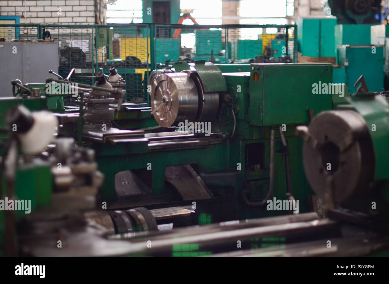 View of a large metal industrial machine in the shop for processing ...