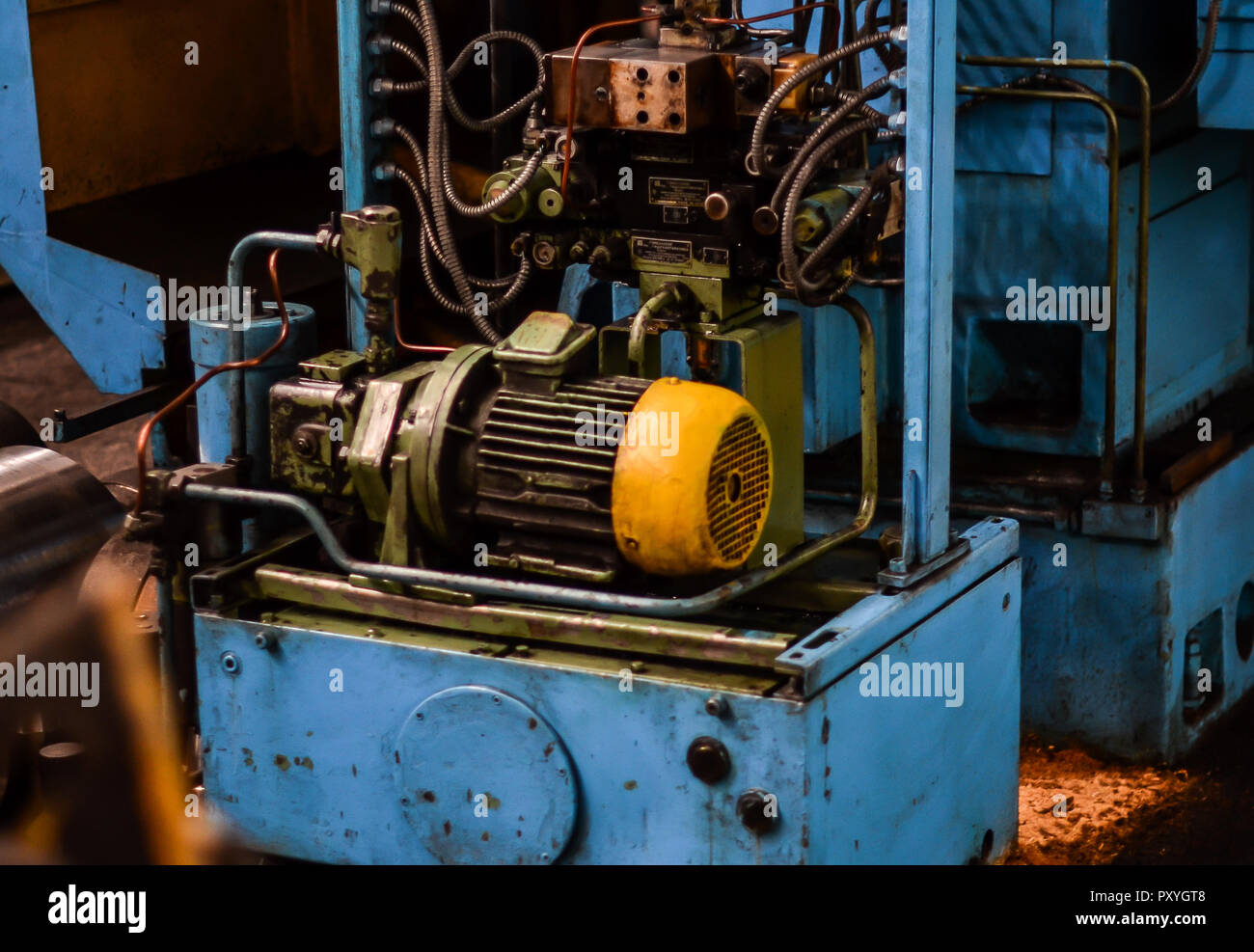 View of an electric motor mounted on an industrial machine in the ...