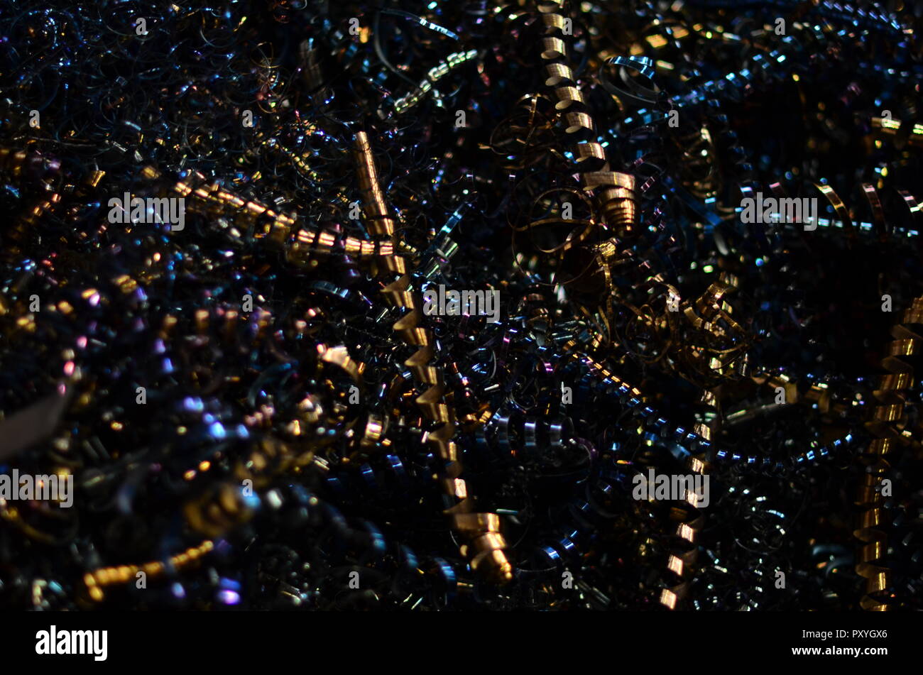 Metal chips after machining parts on a milling machine at the factory ...