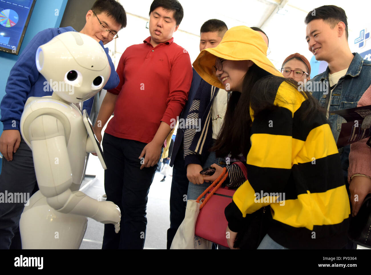 Hefei, China's Anhui Province. 24th Oct, 2018. A woman interacts with ...